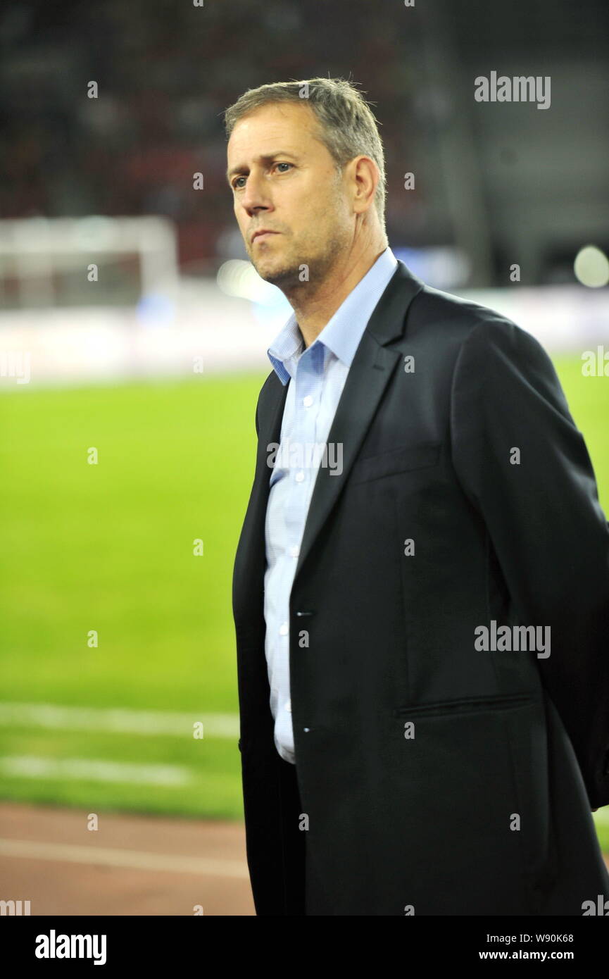 Head coach Alain Perrin of China looks on during a friendly football ...