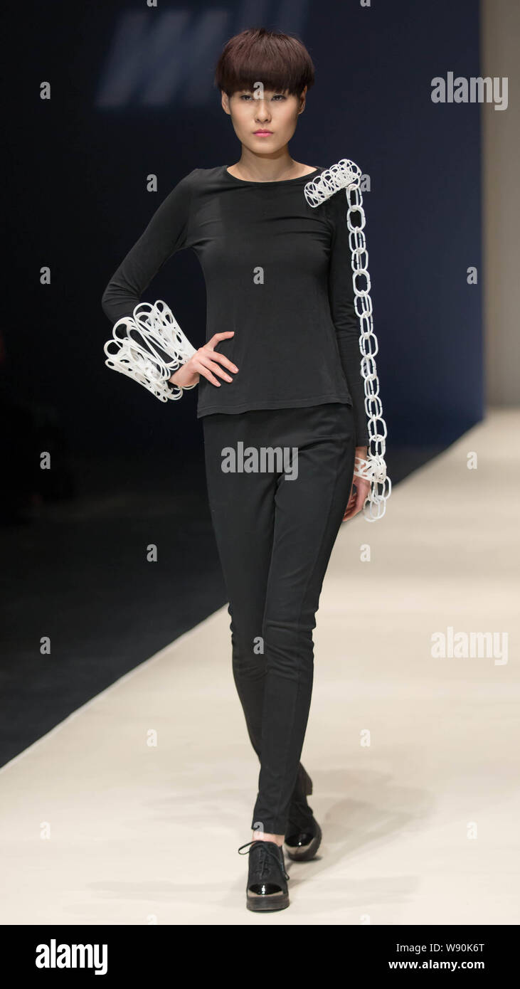A model displays a creation by a postgraduate at a fashion show for ...