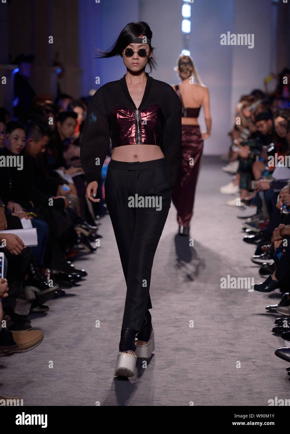 A model displays a new creation at the Simon Gao Spring/Summer 2015 fashion show in Shanghai ...