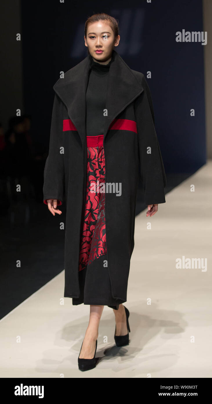 A model displays a creation by a postgraduate at a fashion show for ...