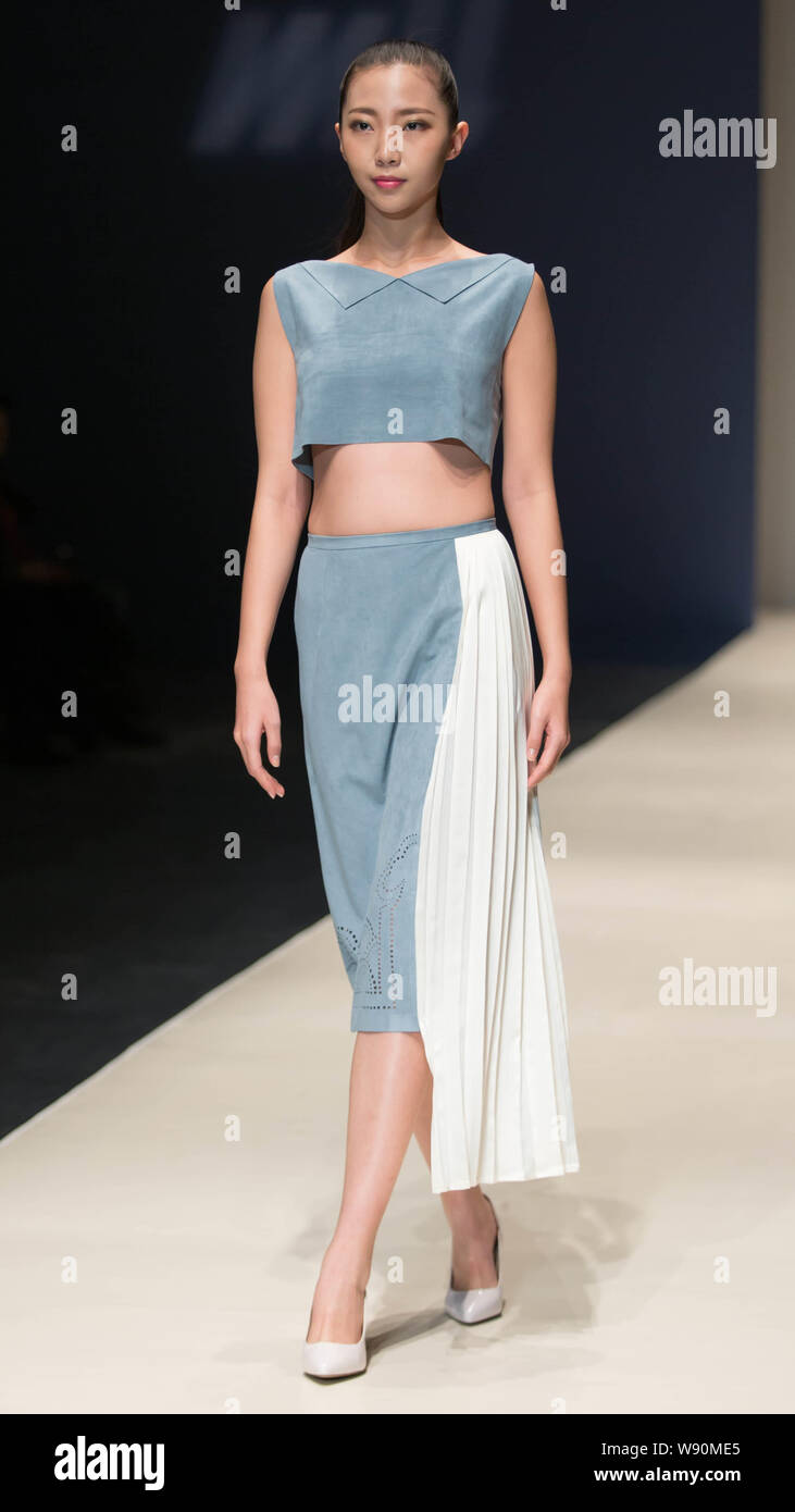 A model displays a creation by a postgraduate at a fashion show for ...