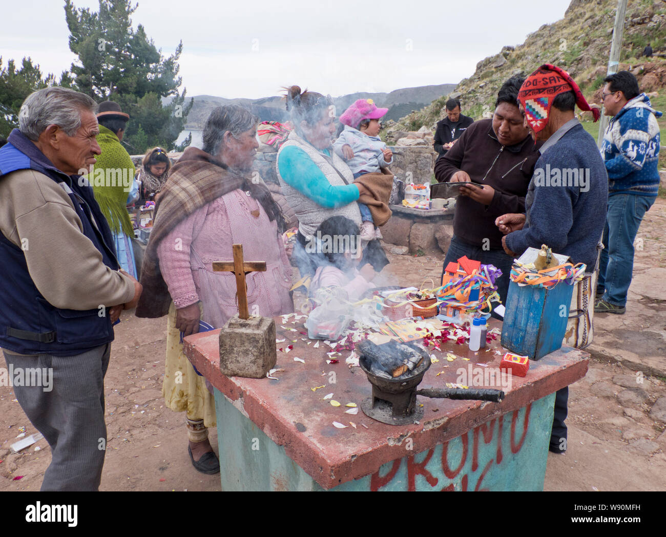 Native Aymara healer performing a ceremony for a local family in the ...