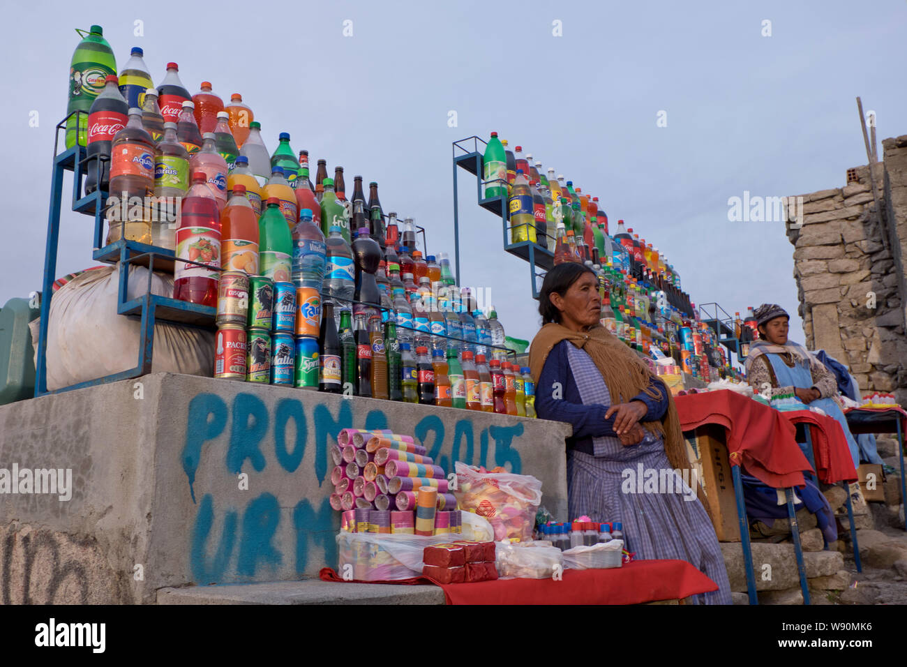 Native Aymara woman selling food and drinks in the resort of Copacabana ...