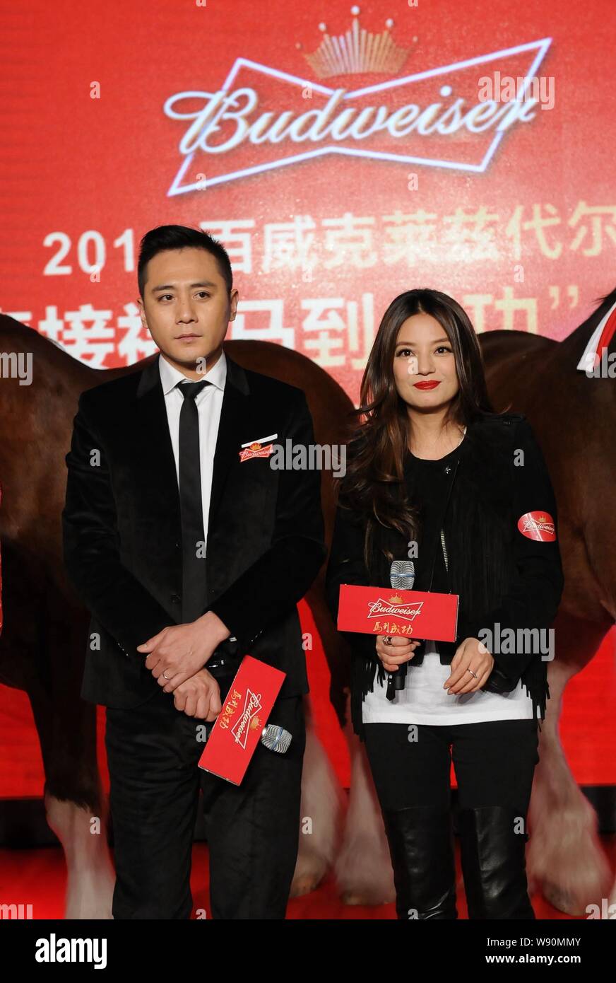 Chinese actor Liu Ye, left, and actress Zhao Wei, right, pose during a ...