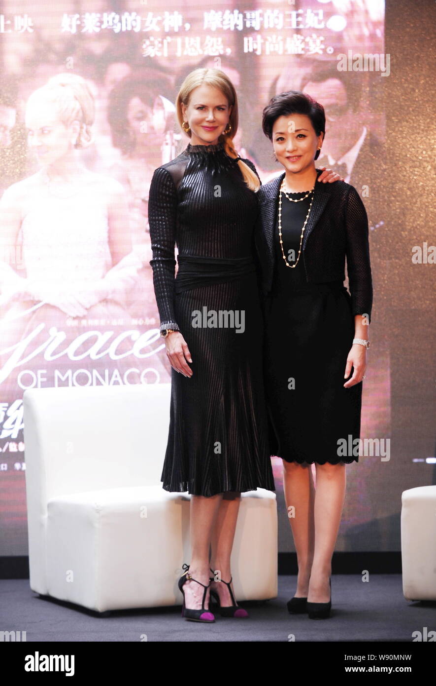 Australian actress Nicole Kidman, left, poses with Chinese TV hostess ...