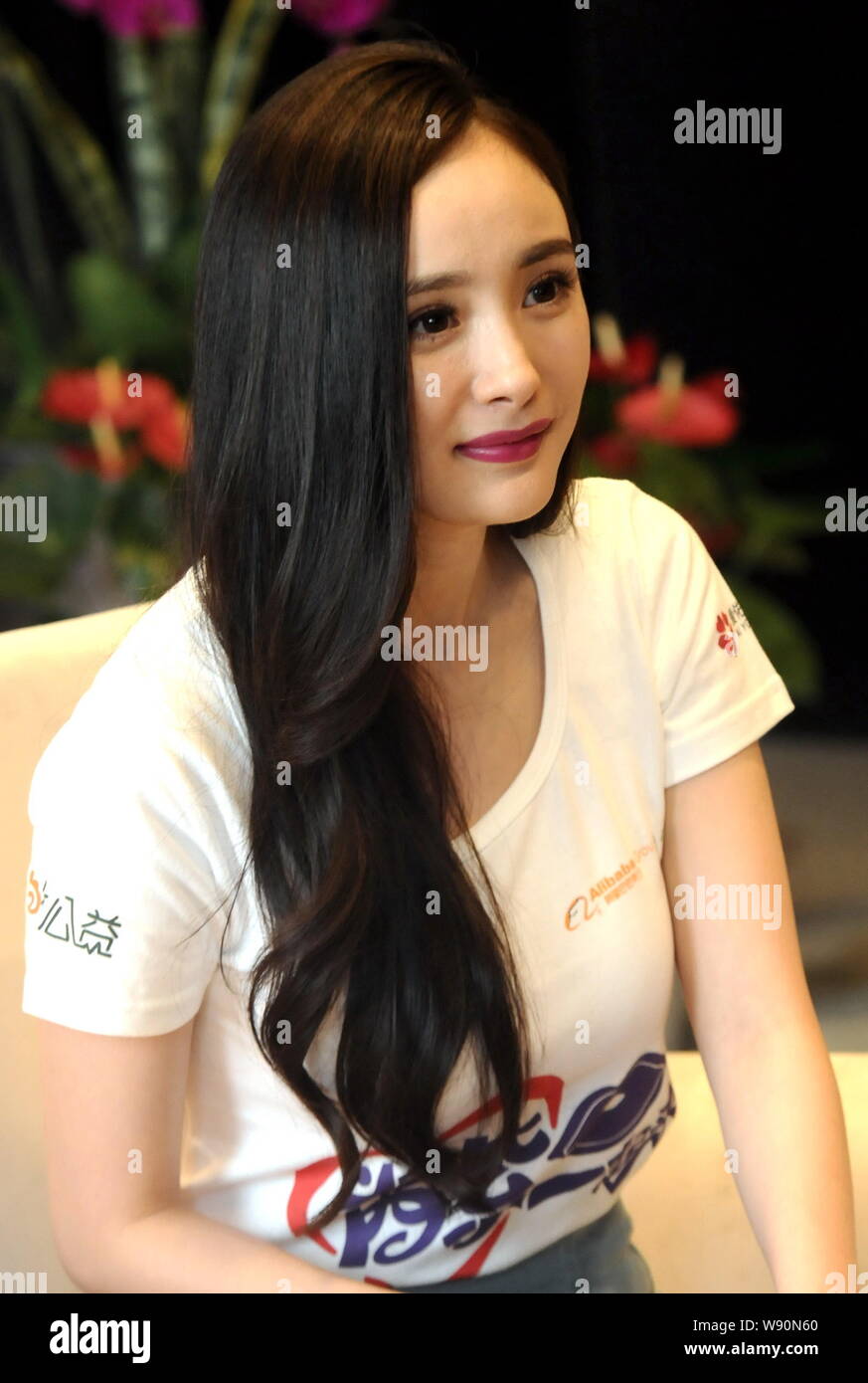 Chinese actress Yang Mi poses during a press conference after a charity ...