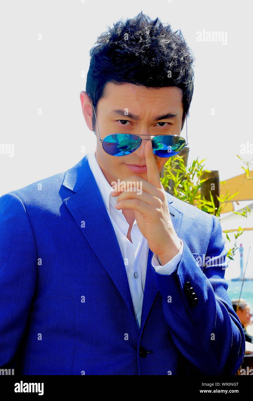 Chinese actor Huang Xiaoming poses at a photocall for his movie, The ...
