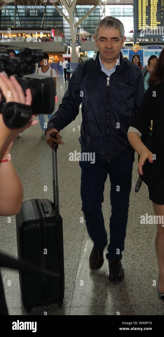 English actor Rowan Atkinson arrives at the Shanghai Pudong ...