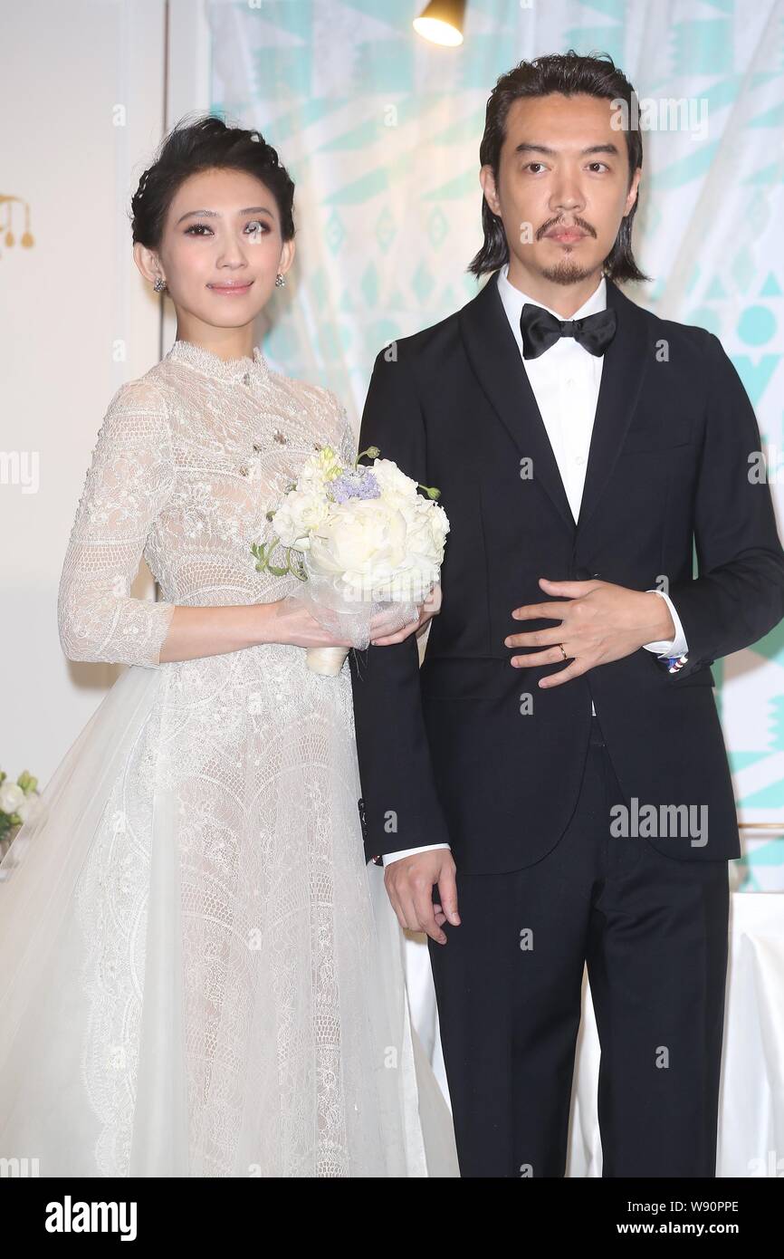 Malaysian singer Penny Tai, left, poses with her Taiwanese husband Sidney Lu ahead of their ...