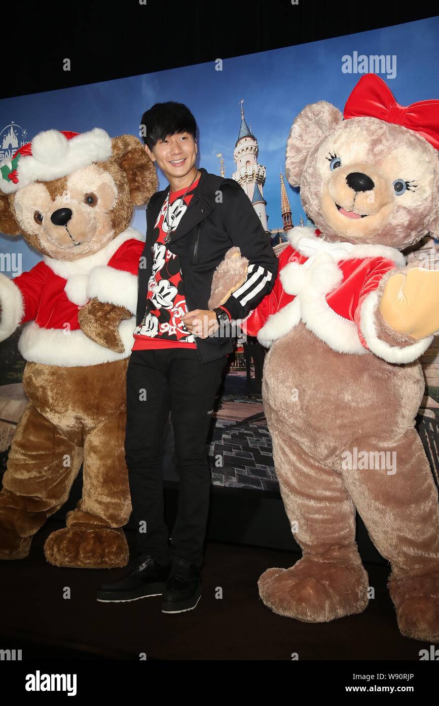 Singaporean singer JJ Lin, center, poses with two mascot bears at a ...