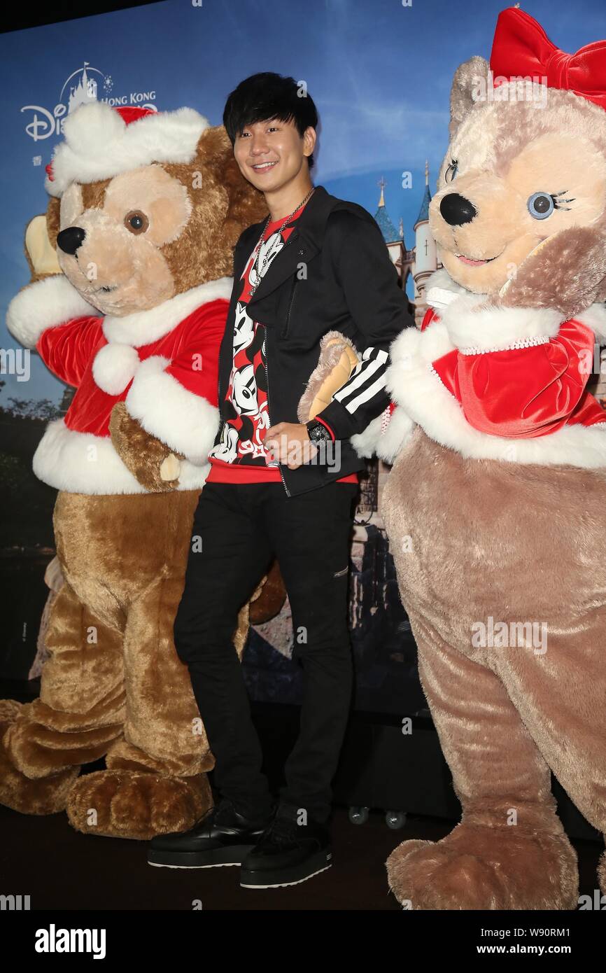 Singaporean singer JJ Lin, center, poses with two mascot bears at a ...