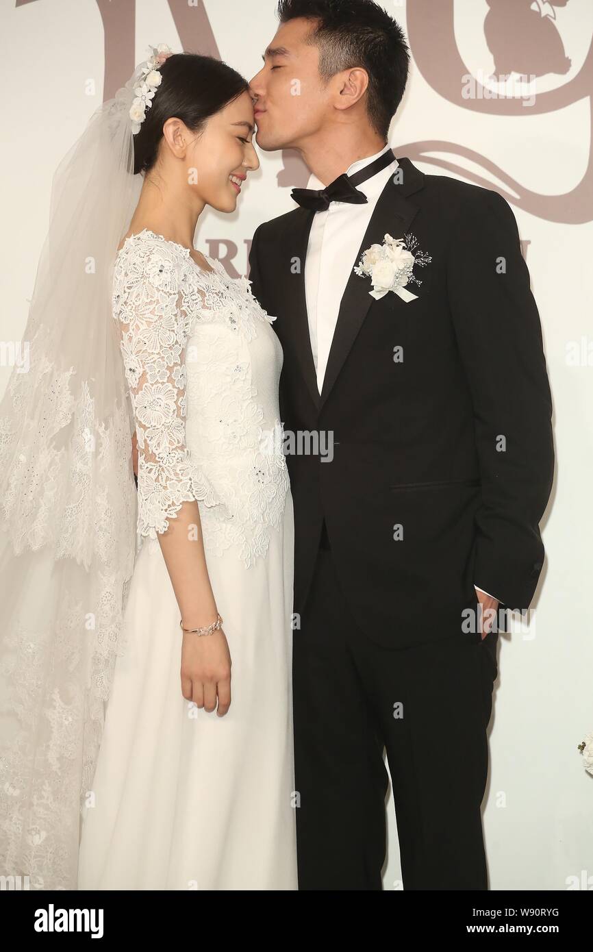 Chinese actress Gao Yuanyuan, left, is kissed by her Taiwanese actor ...