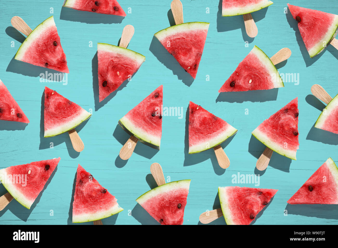 Watermelon pattern. Sliced watermelon on color background Stock Photo ...