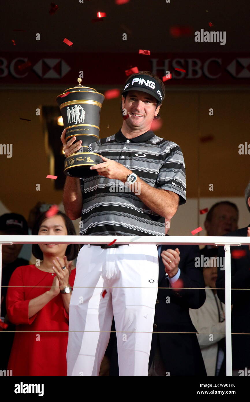 Bubba Watson of the United States celebrates with his champion trophy ...