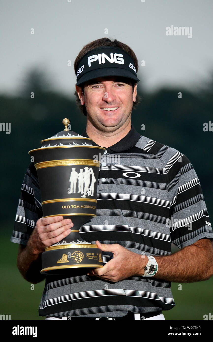 Bubba Watson of the United States poses with his champion trophy during ...