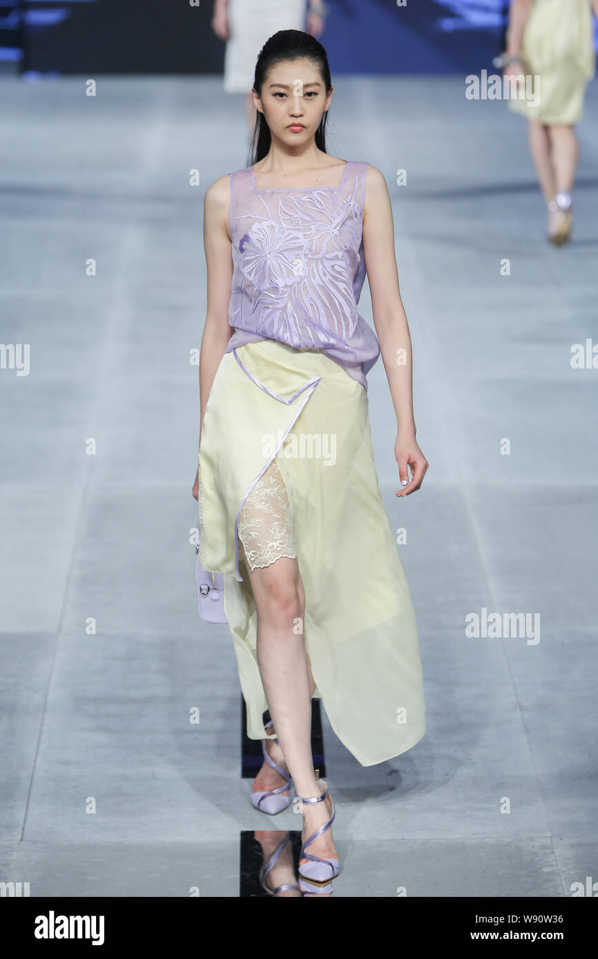 A model displays a new creation by designer Xie Feng at the Jefen Xie ...