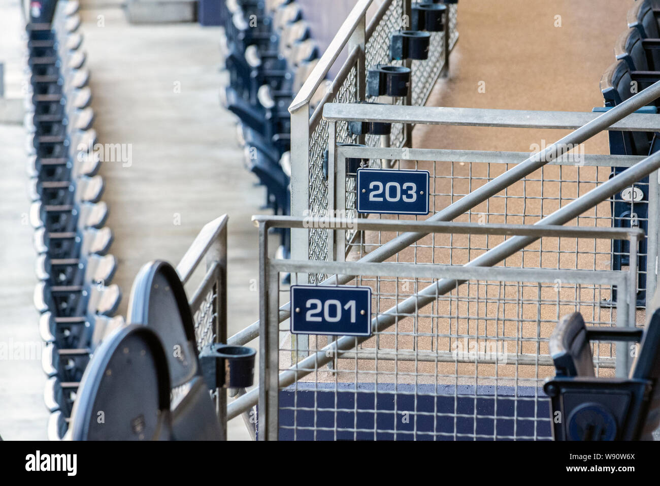 Signage marking sections 201 and 203 at baseball venue stadium between ...