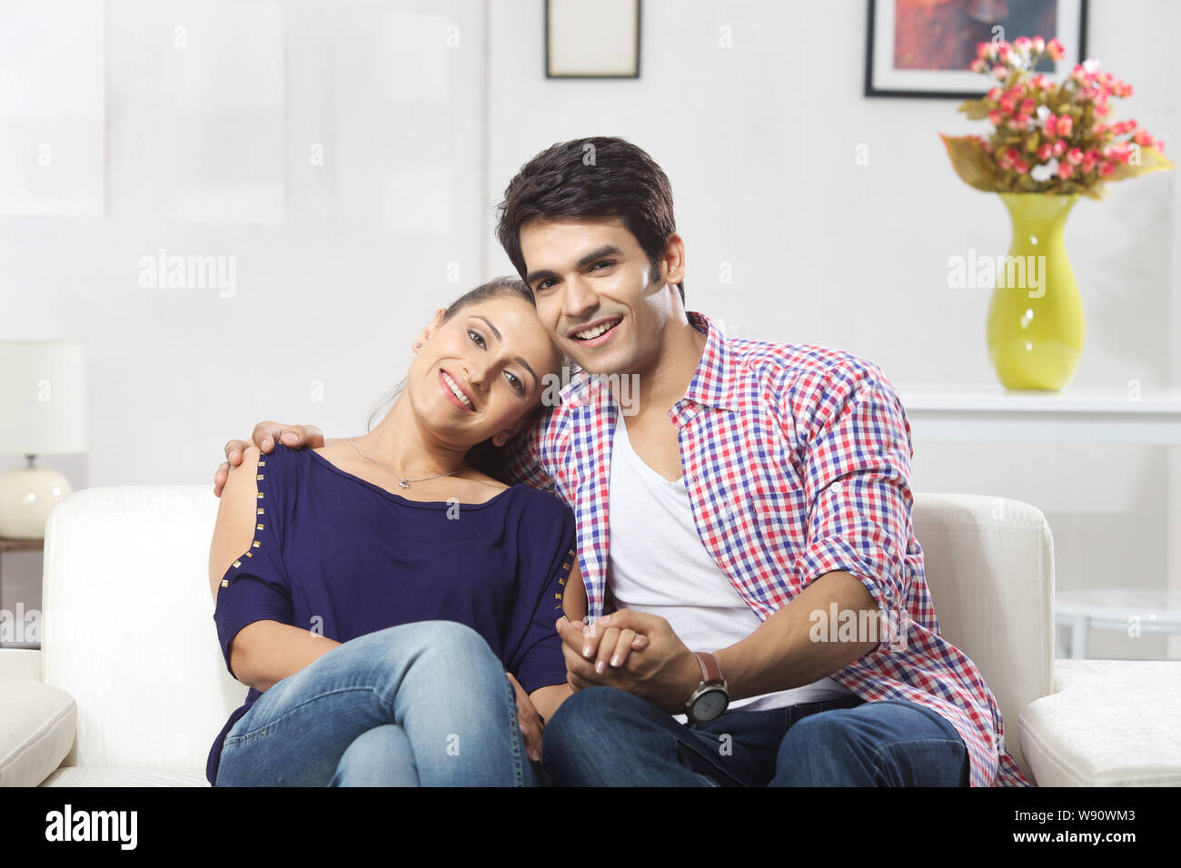 Couple holding hands sitting down hi-res stock photography and images ...
