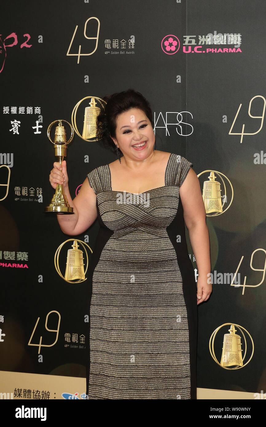 Taiwanese actress Chung Hsin-Ling holds her trophy after winning the ...