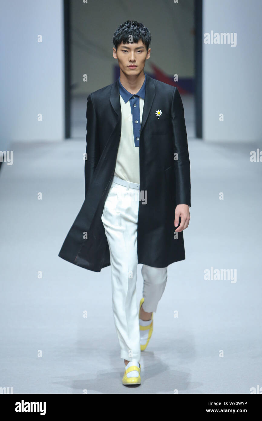 A model displays a new creation by designer Wang Yutao at the Beauty Berry fashion show during ...