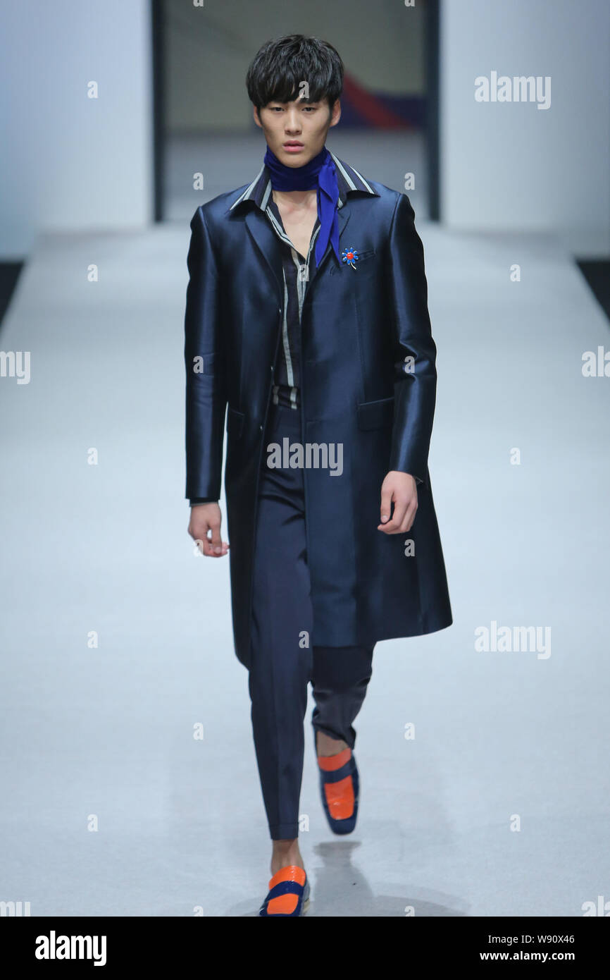 A model displays a new creation by designer Wang Yutao at the Beauty Berry fashion show during ...