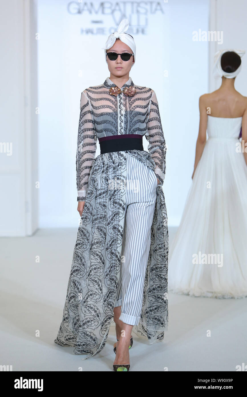 A model displays a new creation at the Giambattista Valli Haute Couture ...