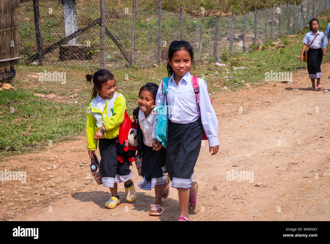 Kids walking home from school hi-res stock photography and images - Alamy