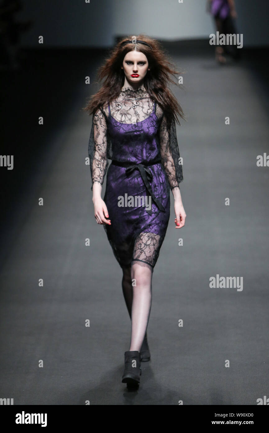 A model displays a new creation at the Elysee Yang fashion show during ...