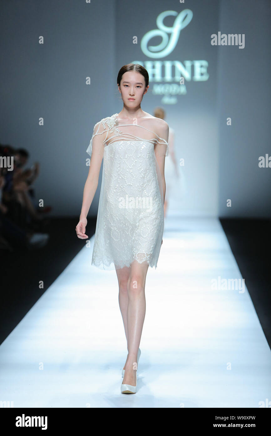 A model displays a new creation at the SHINE MODA fashion show during ...