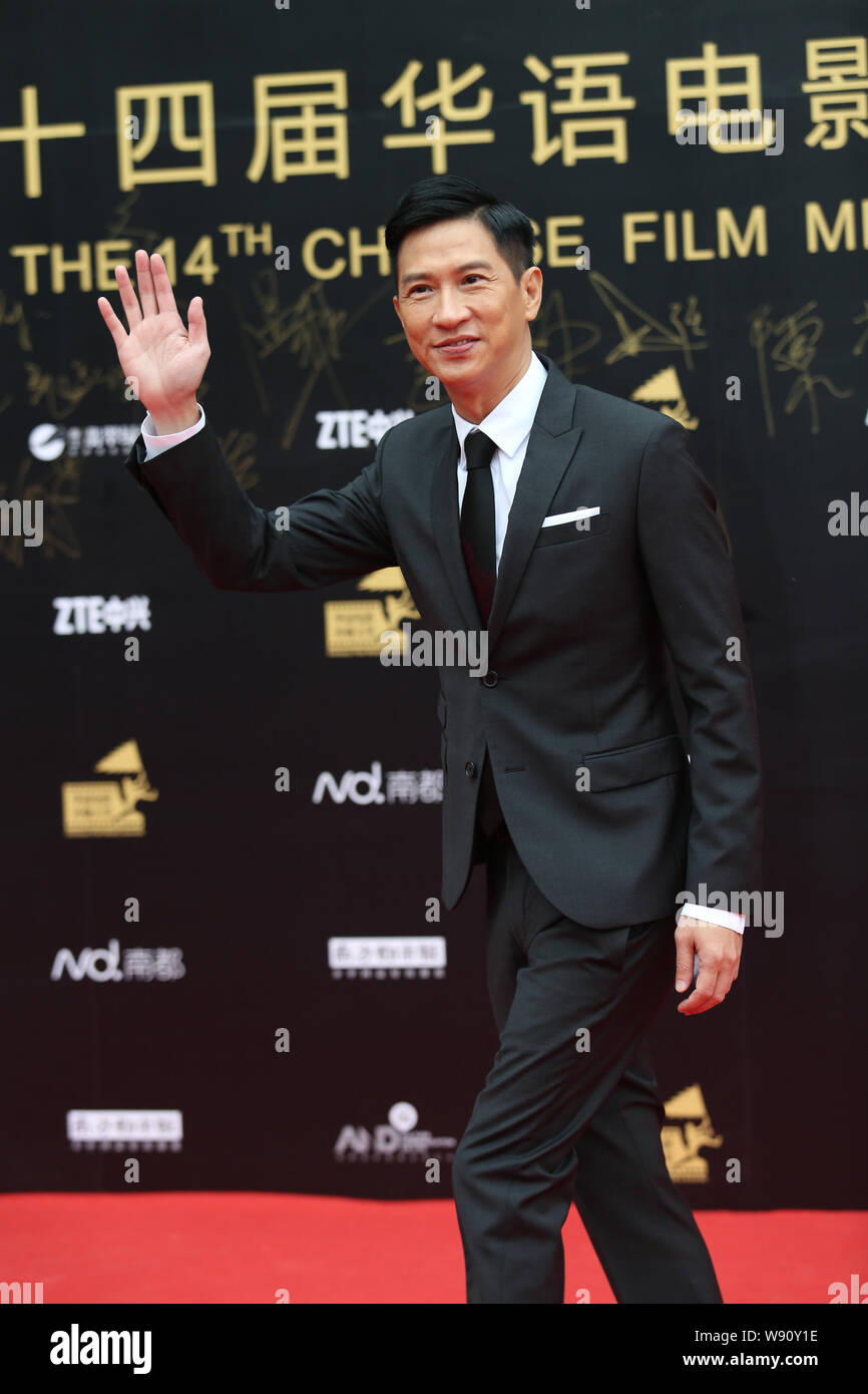 Hong Kong actor Nick Cheung waves on the red carpet for the 14th ...