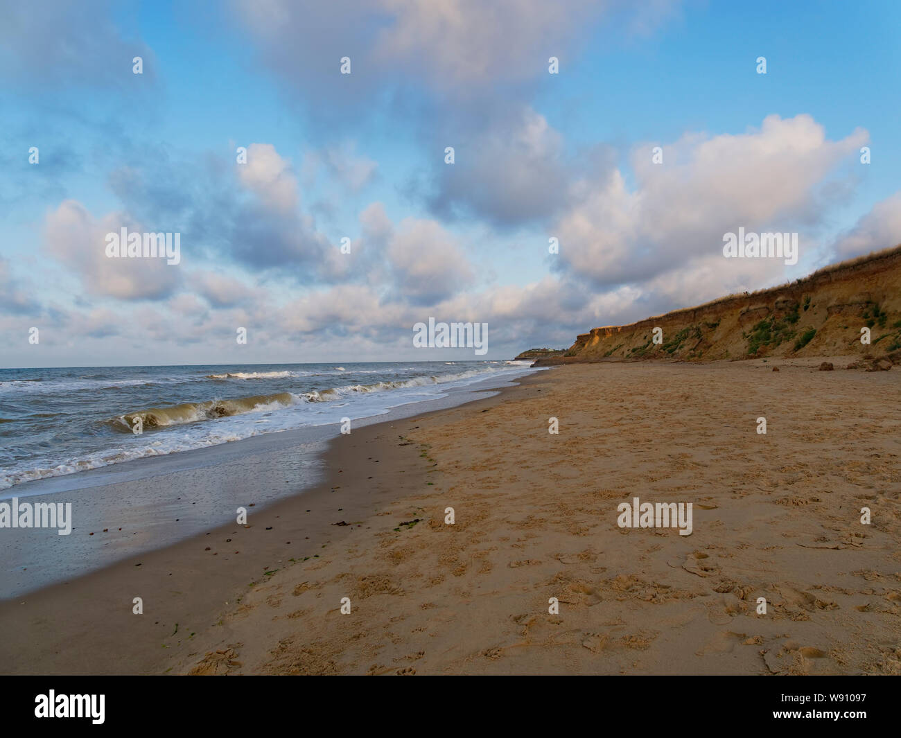 Soft, fragile cliffs line Happisburgh beach in the English county of ...