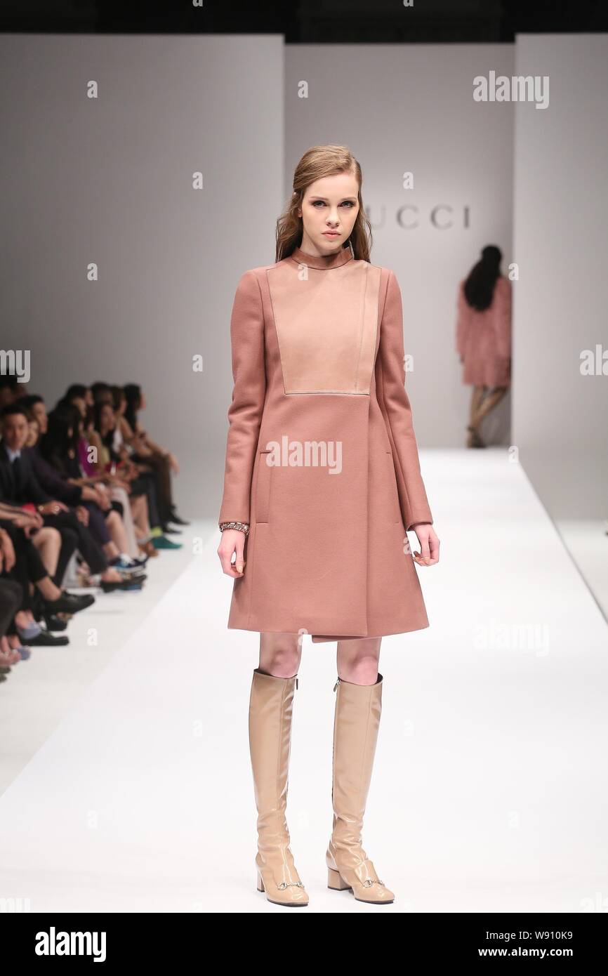 A model displays a new creation during the Gucci 2014 Autumn/Winter ...