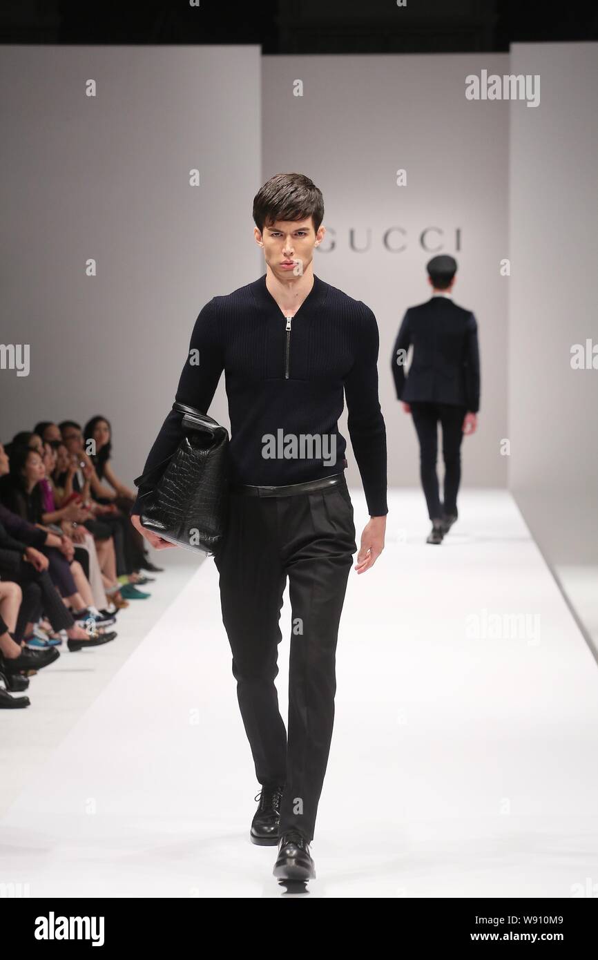 A model displays a new creation during the Gucci 2014 Autumn/Winter ...