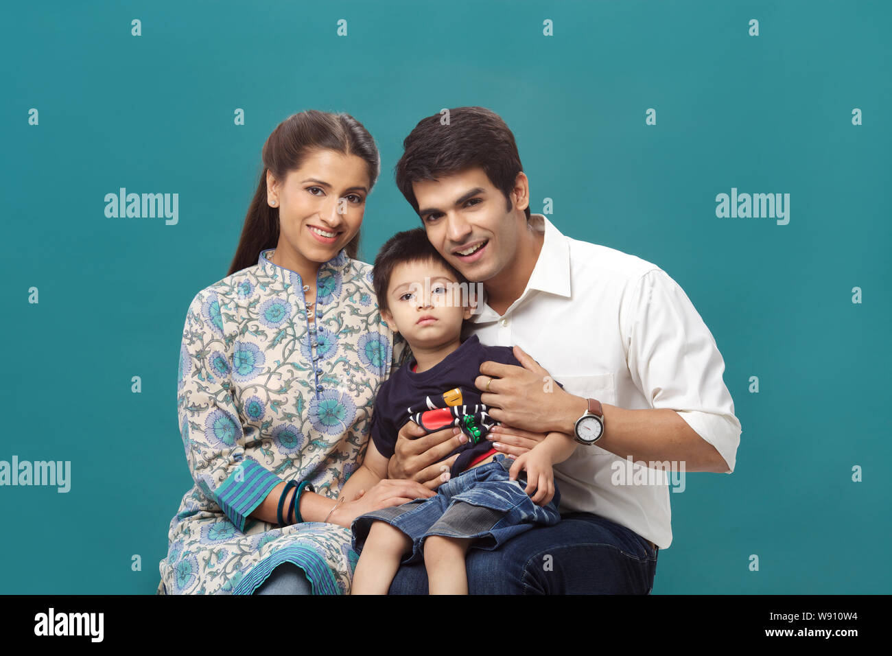 Family sitting together Stock Photo - Alamy