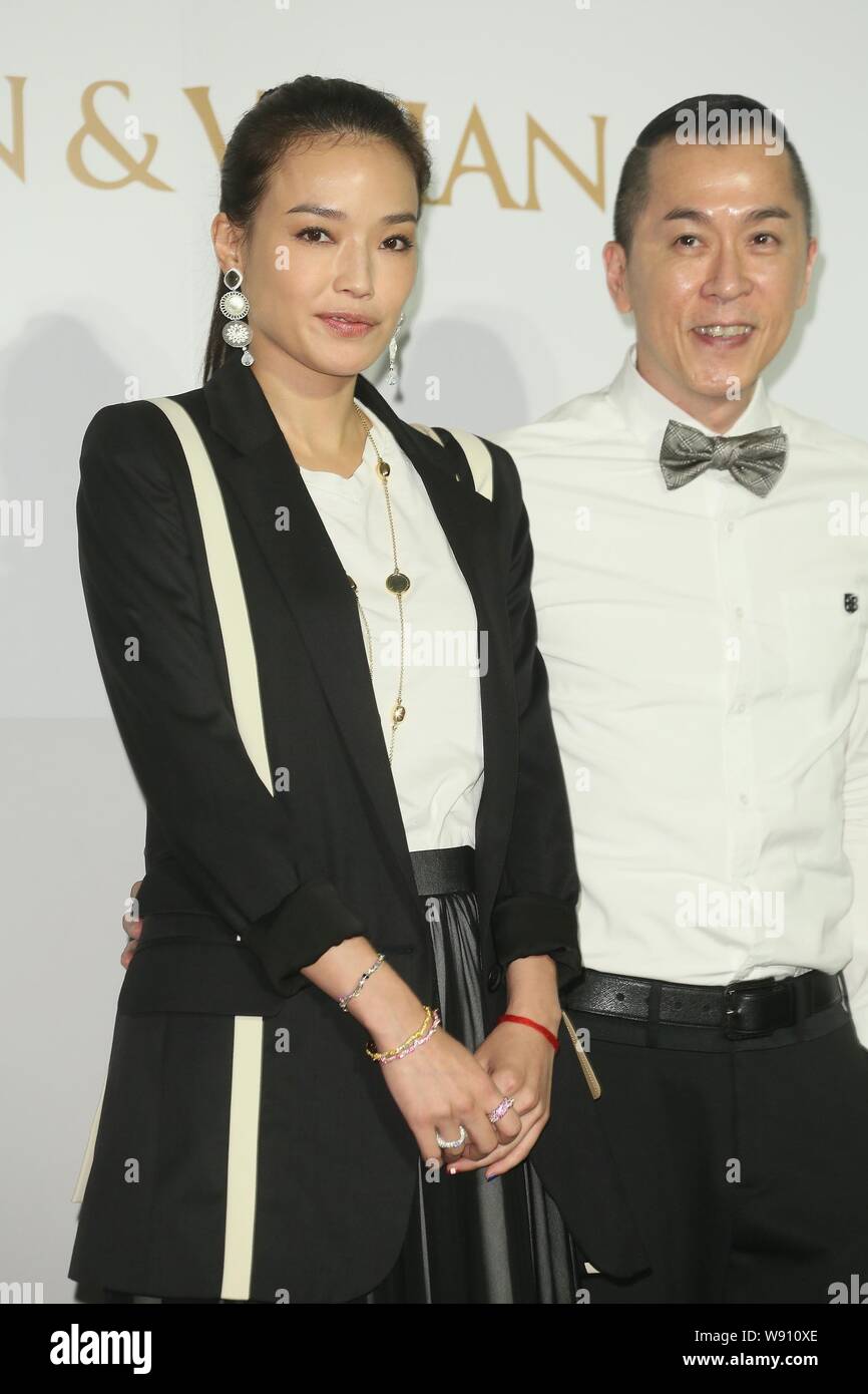 Taiwanese actress and model Shu Qi, left, poses as she arrives at ...