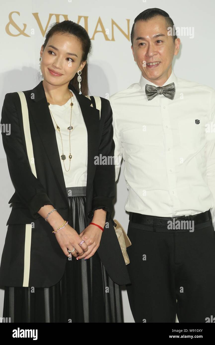Taiwanese actress and model Shu Qi, left, poses as she arrives at ...