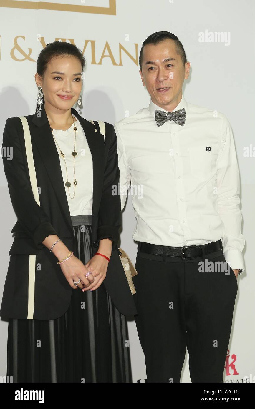 Taiwanese actress and model Shu Qi, left, poses as she arrives at ...