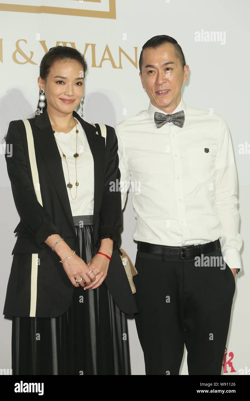 Taiwanese actress and model Shu Qi, left, poses as she arrives at ...