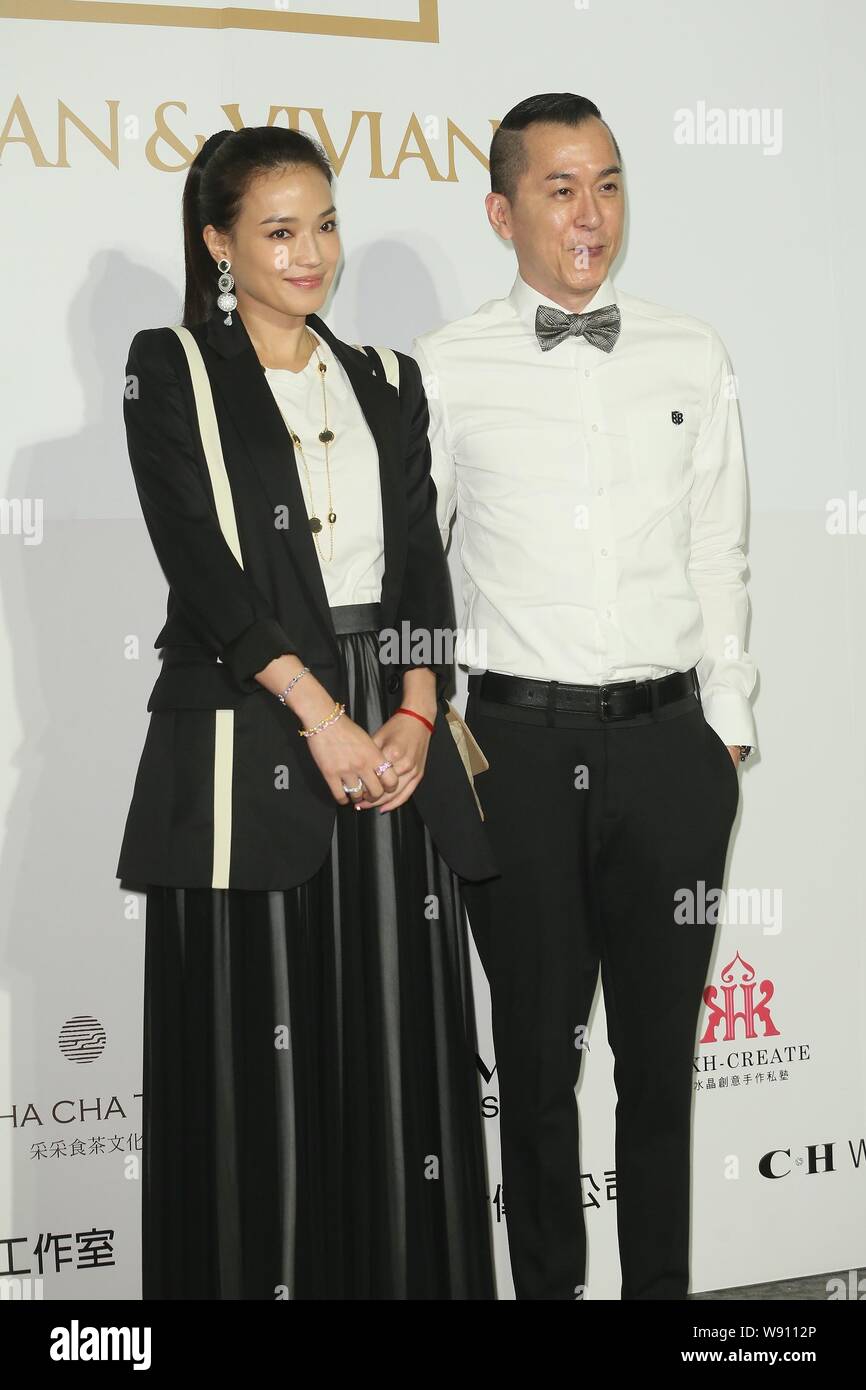 Taiwanese actress and model Shu Qi, left, poses as she arrives at ...