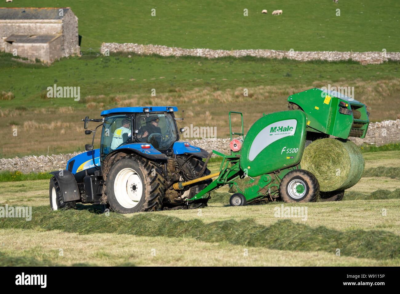 Making haylage crop on a hill farm, with a New Holland T6030 and a ...