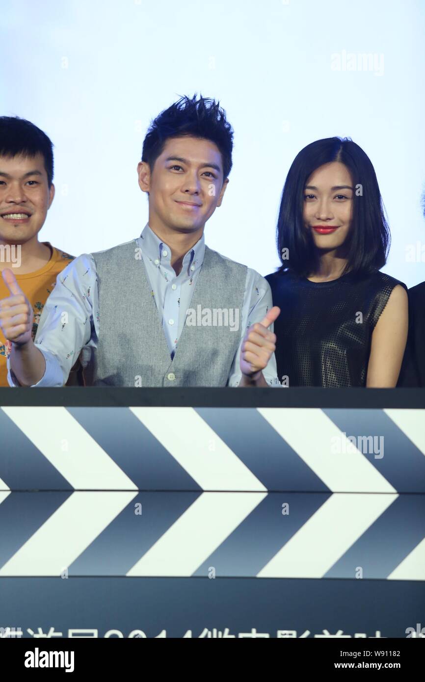Taiwanese singer and actor Jimmy Lin, center, poses during a premiere ...