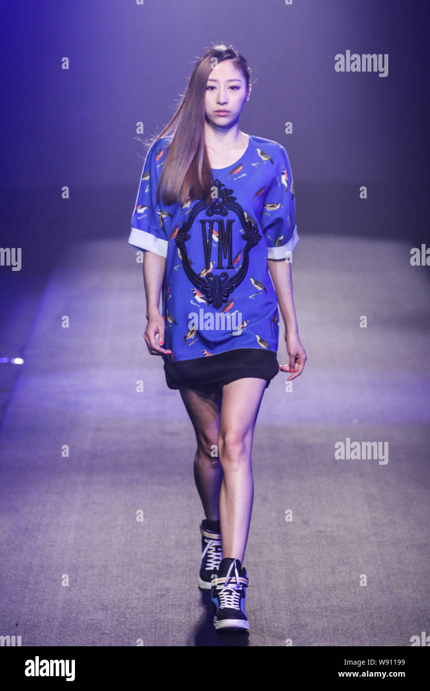 A model displays a new creation designed by South Korean model and ...