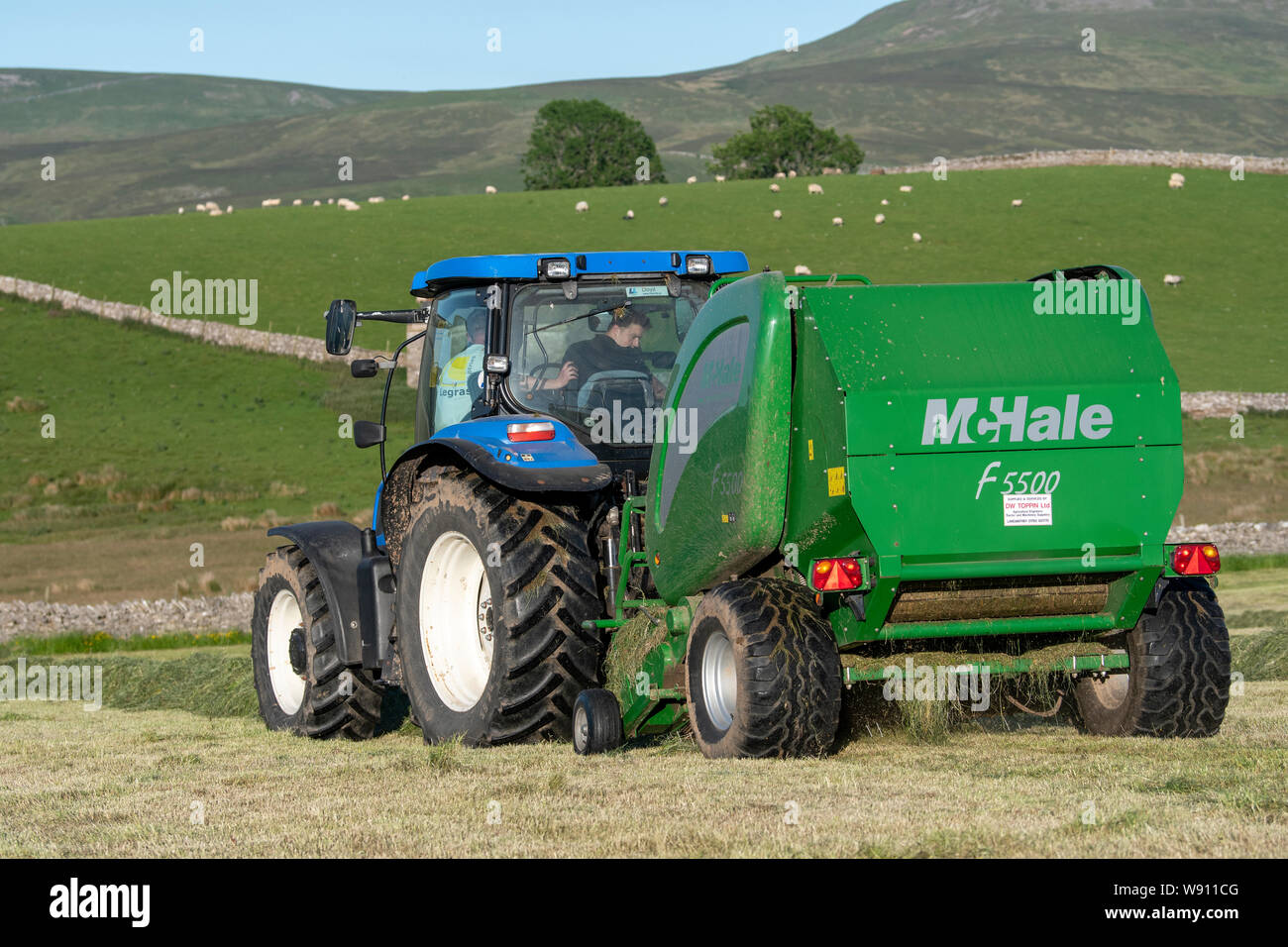 Making haylage crop on a hill farm, with a New Holland T6030 and a ...
