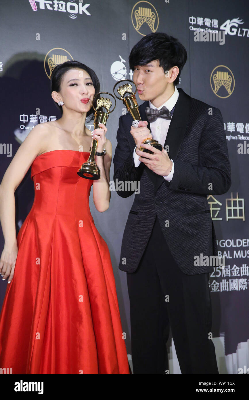 Malaysian singer Penny Tai, left, and Singaporean singer JJ Lin kiss ...