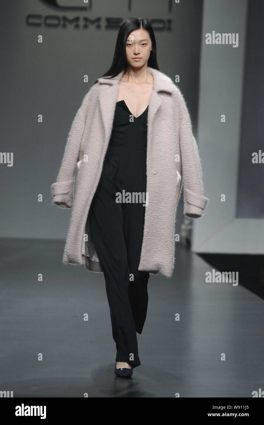 Chinese model You Tianyi displays a new creation designed by Chinese ...