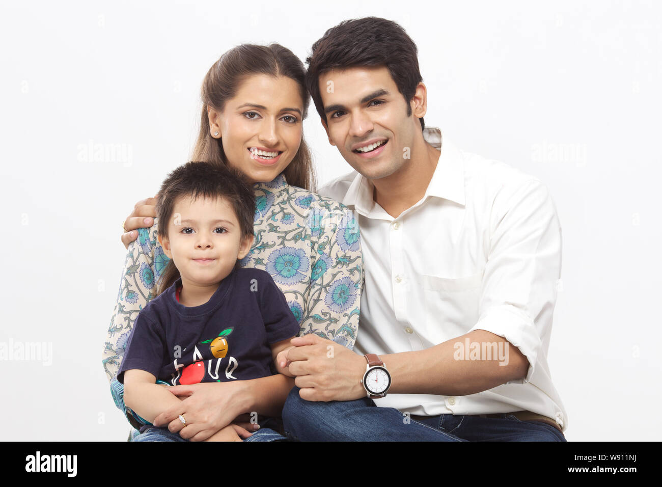 Family sitting together Stock Photo - Alamy