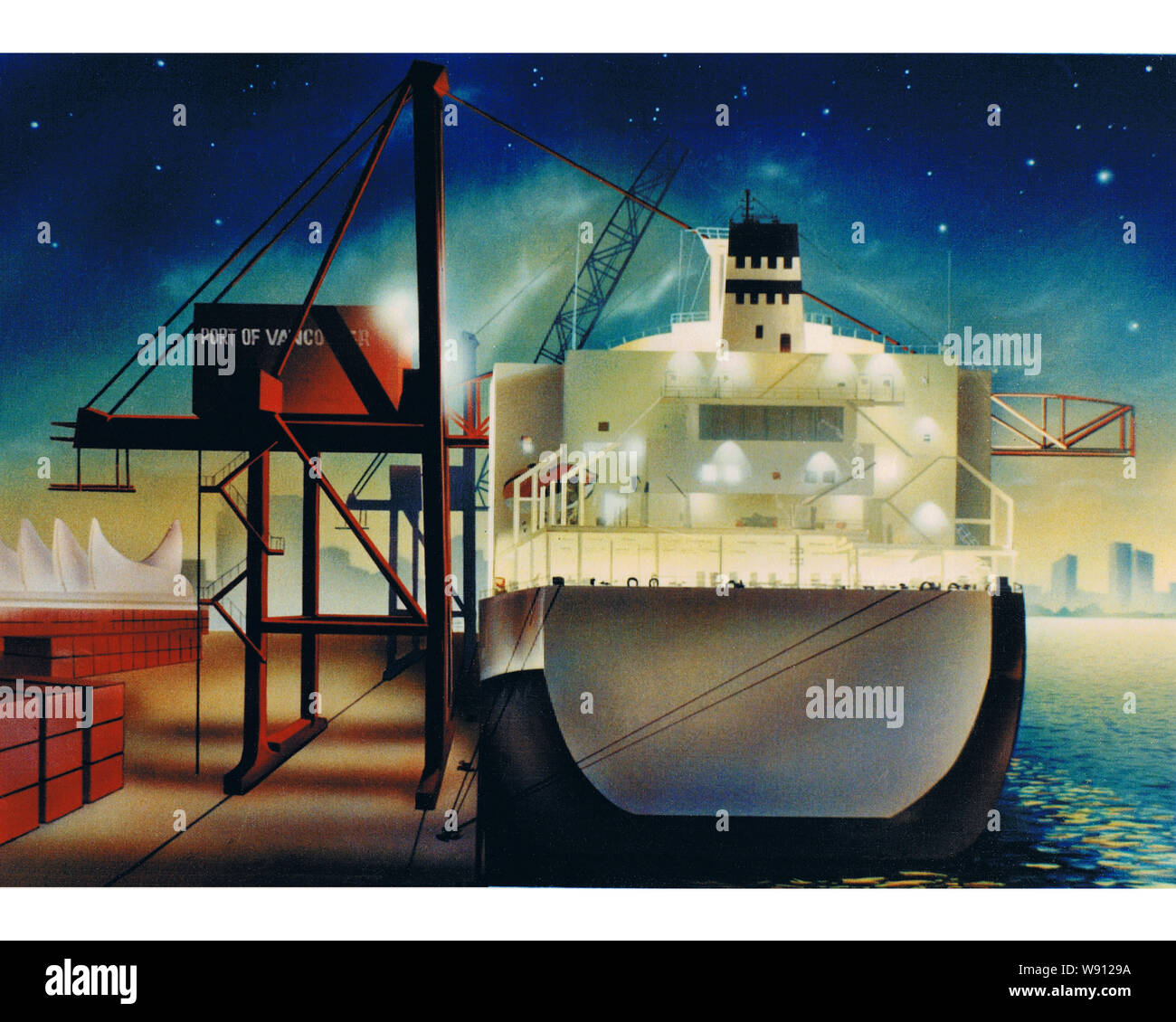 Ship at loading dock at an international port at night alongside port ...