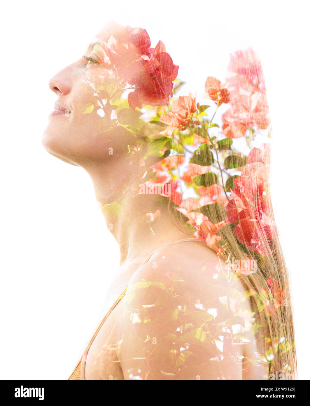 Double exposure portrait combining beautiful flowers with an peaceful ...