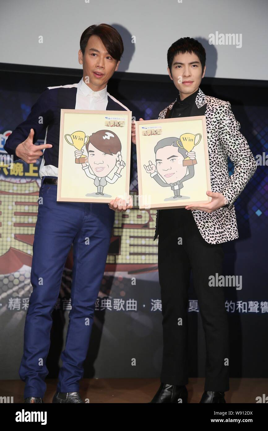Taiwanese singers David Tao, left, and Jam Hsiao show their caricatures ...