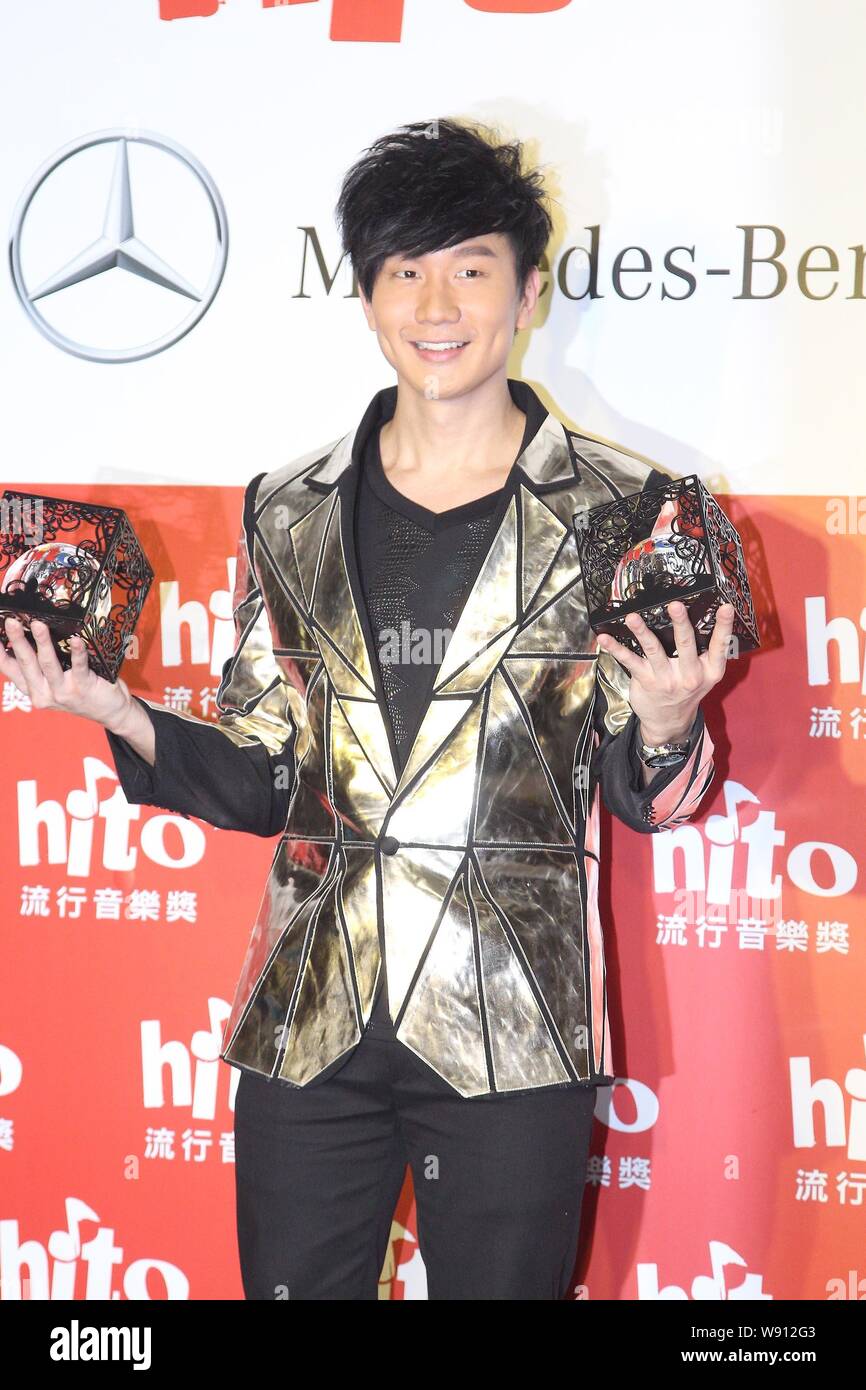 Singaporean singer JJ Lin holds trophies during the 2014 Hito Music ...